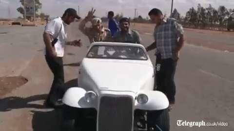 Rebels Loot Gaddafi's Luxury Cars | Military.com